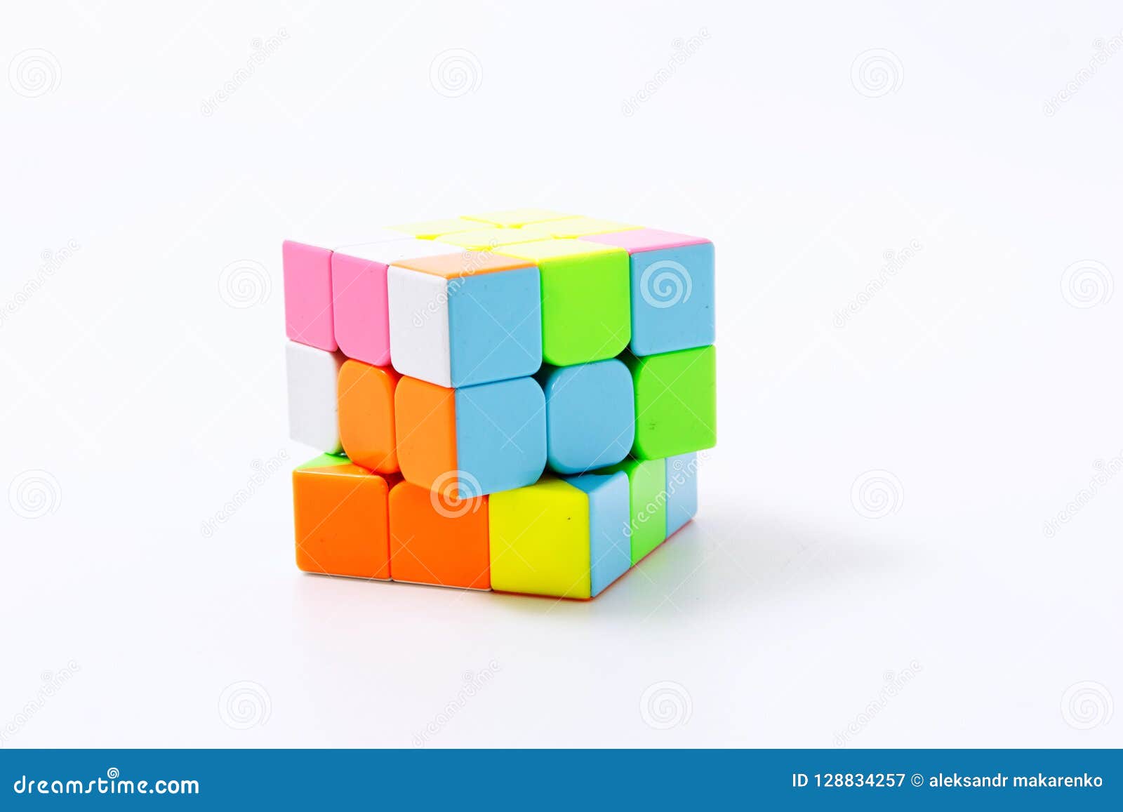 Puzzle Multi-colored Cube on a White Background Isolate. Editorial ...