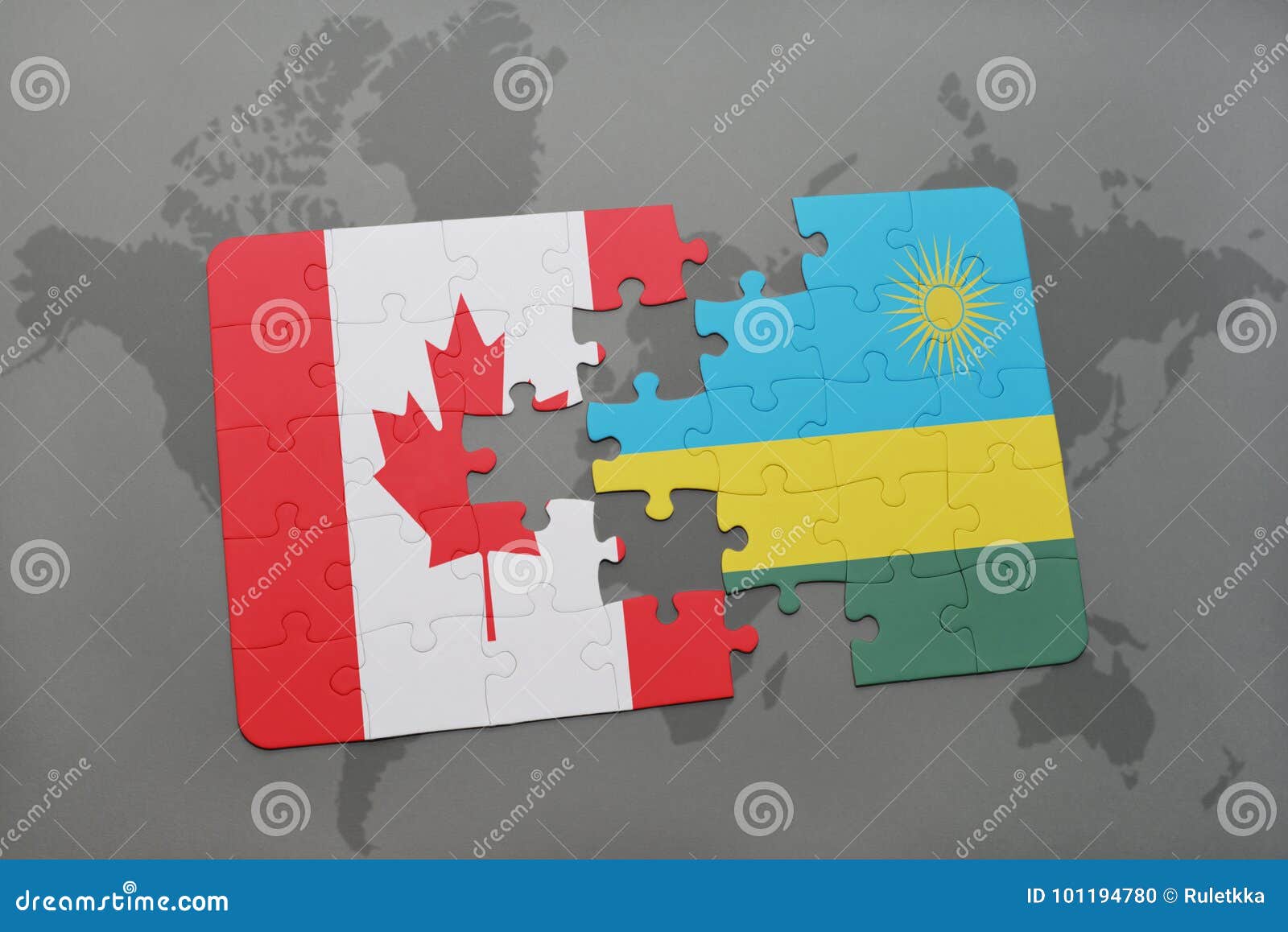 Puzzle with the National Flag of Canada and Rwanda on a World Map ...