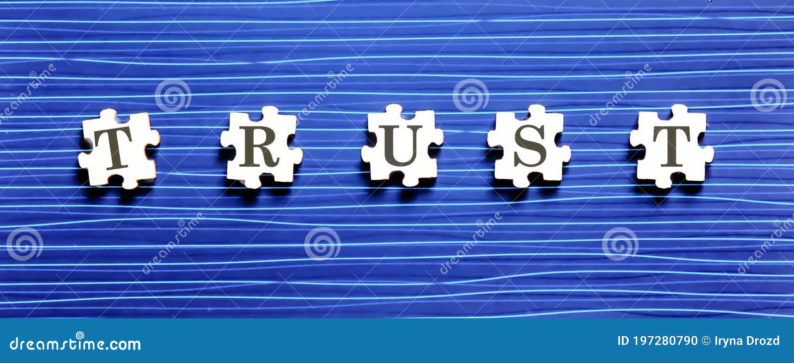 Puzzle Piece with TRUST Text on a Blue Background Stock Photo - Image ...