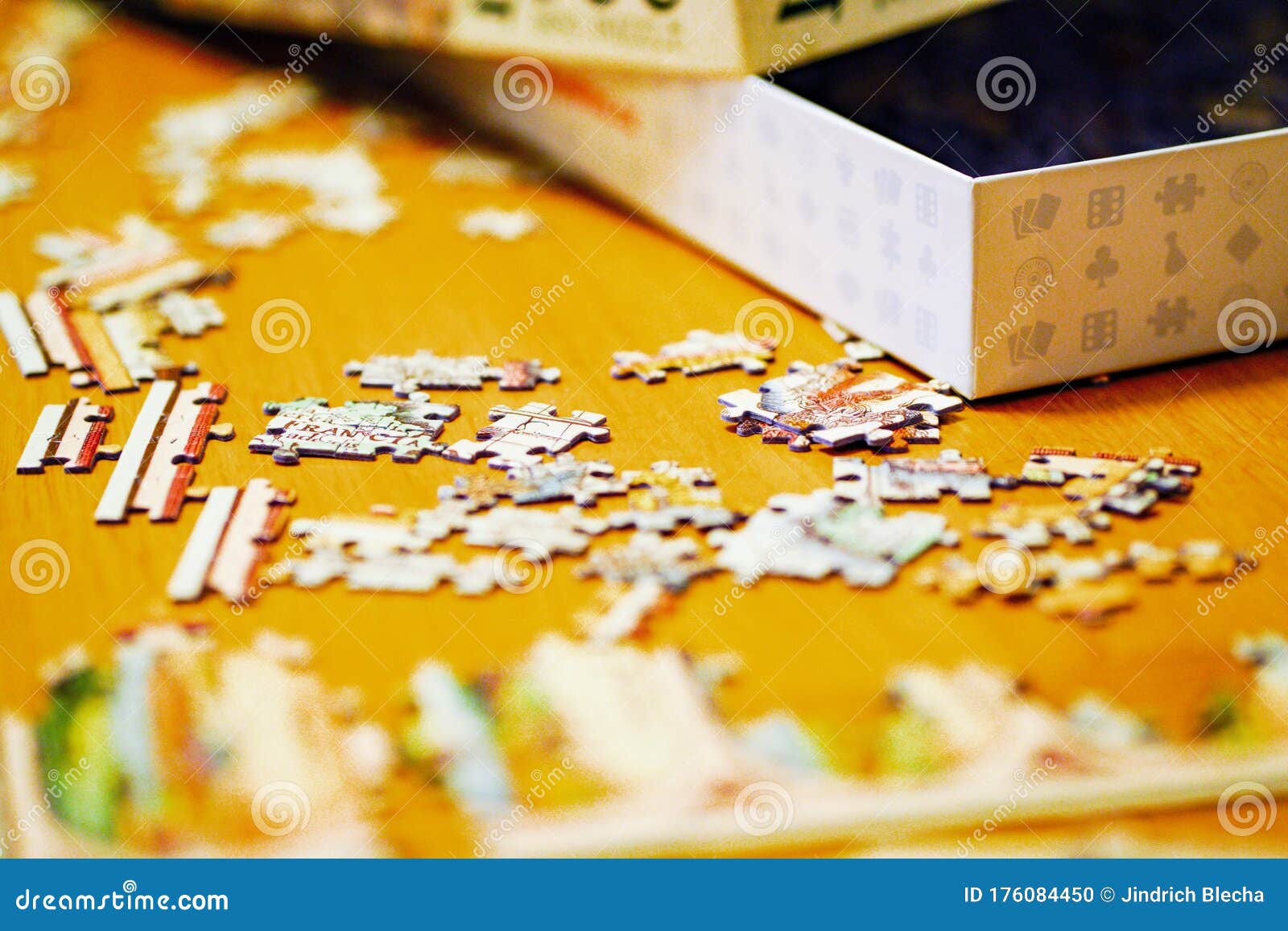 Puzzle Pieces Laying on Table with a Box Stock Photo - Image of level ...