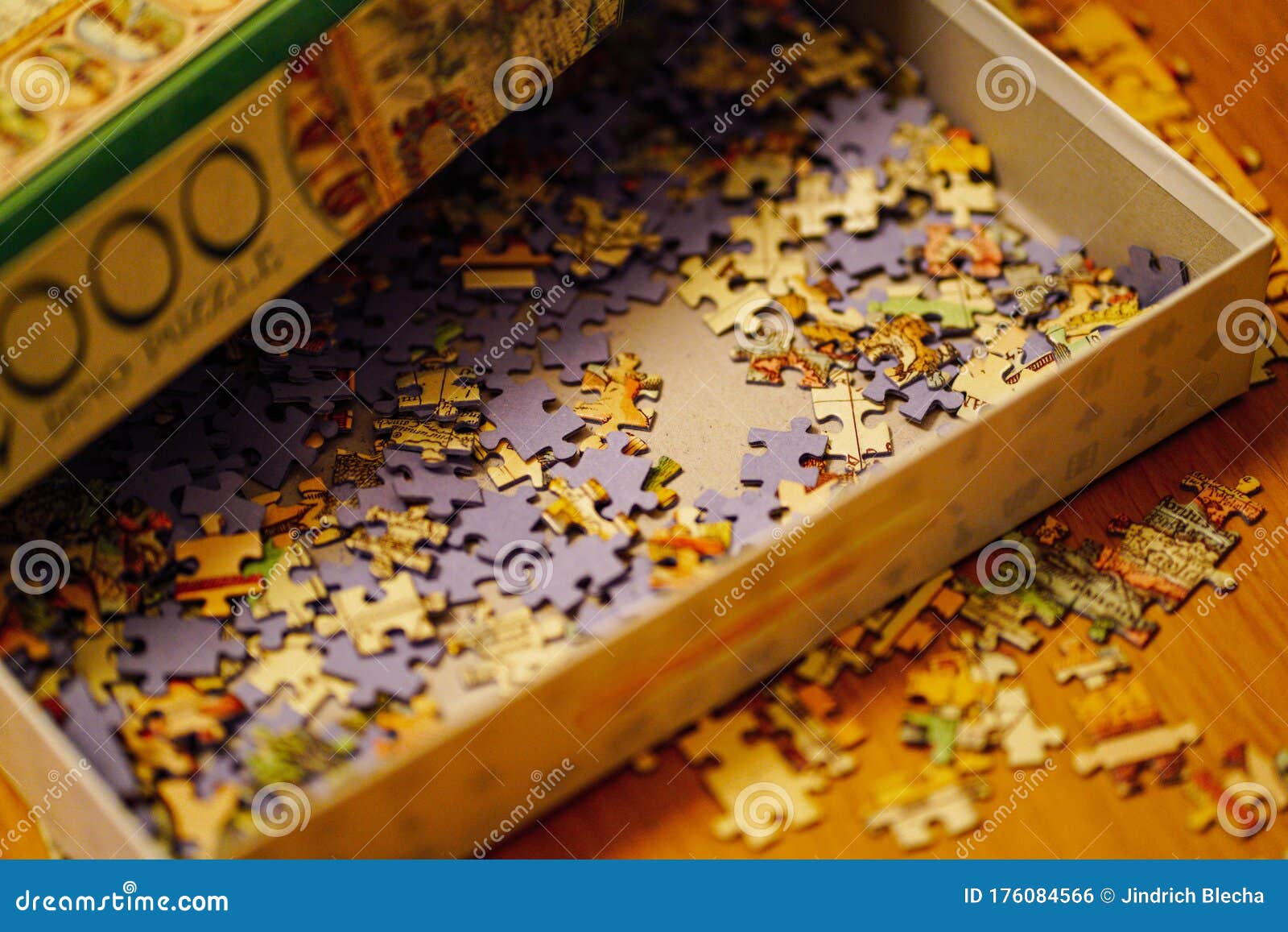 Puzzle Pieces Laying on Table with a Box Stock Photo - Image of ...