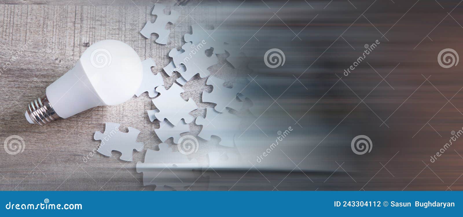 Puzzle Pieces and a Light Bulb on the Table Stock Photo - Image of ...