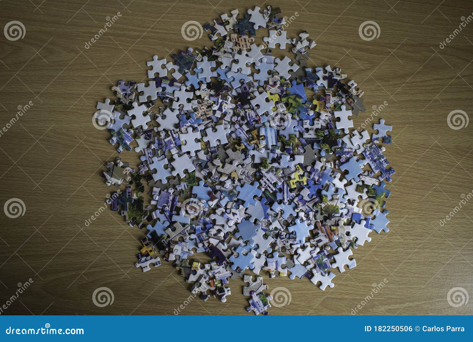 Puzzle Pieces Piled Up on a Wooden Table Stock Photo - Image of ...