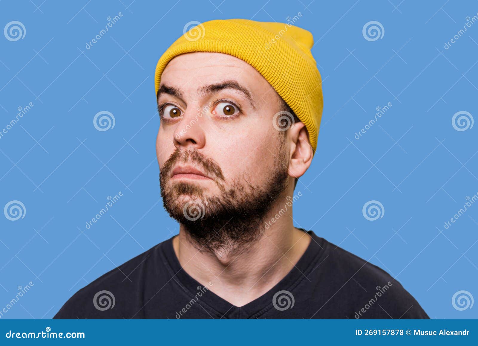 A Puzzled Guy in a Studio Shot. Contorted in a Grimace, Stock Photo ...