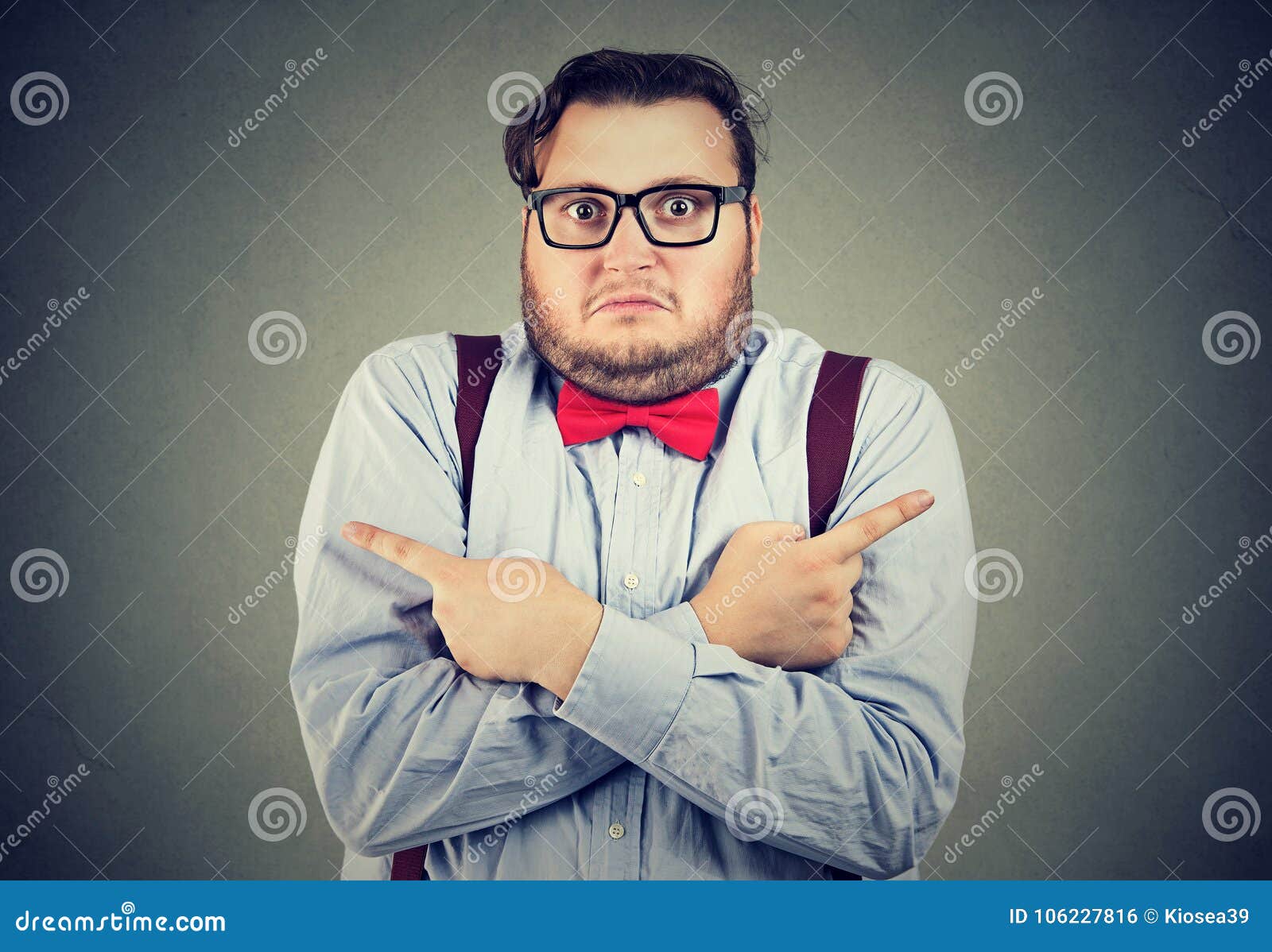 Puzzled Man Pointing Around and Above Stock Photo - Image of helpless ...