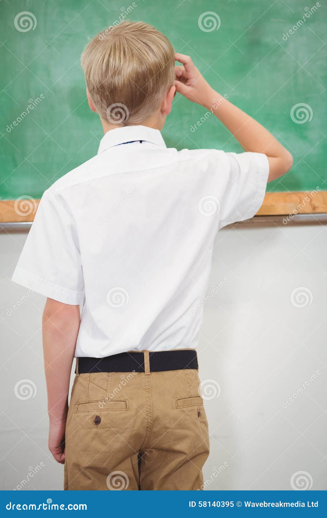 Puzzled Student Looking at Blackboard Stock Image - Image of chalkboard ...