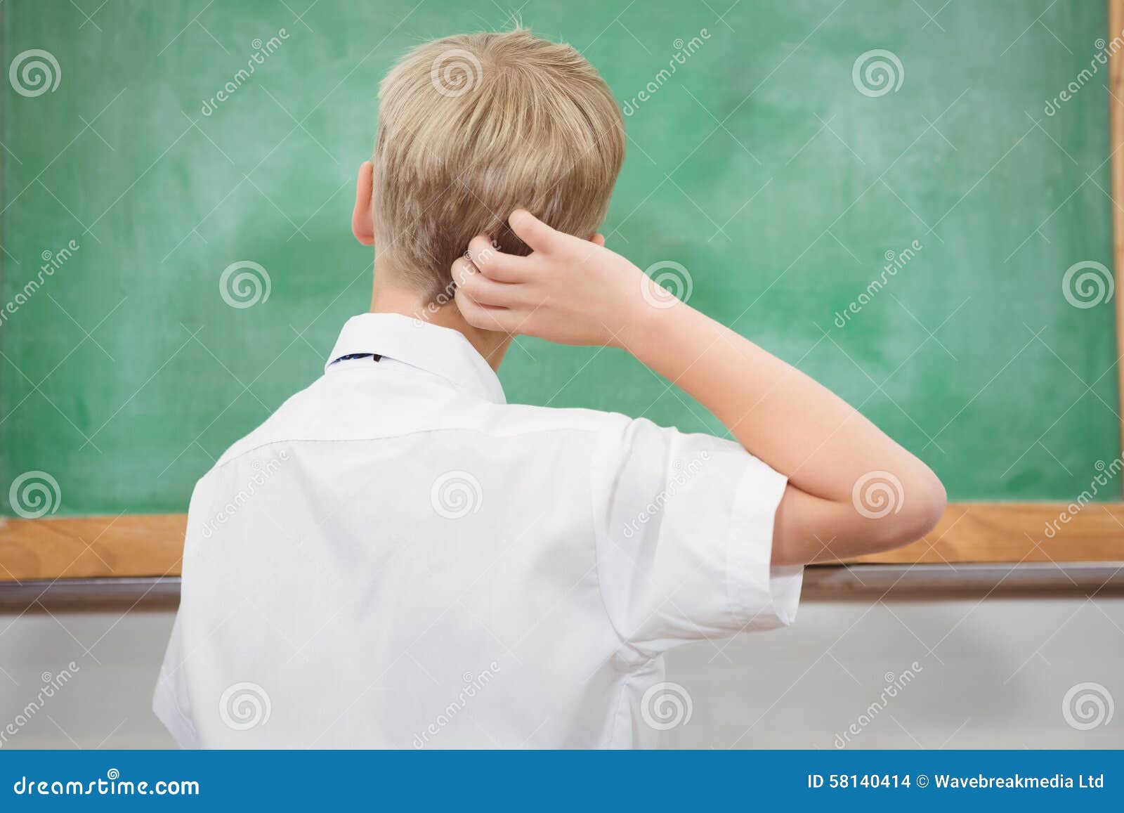 Puzzled Student Looking at Blackboard Stock Photo - Image of thinking ...