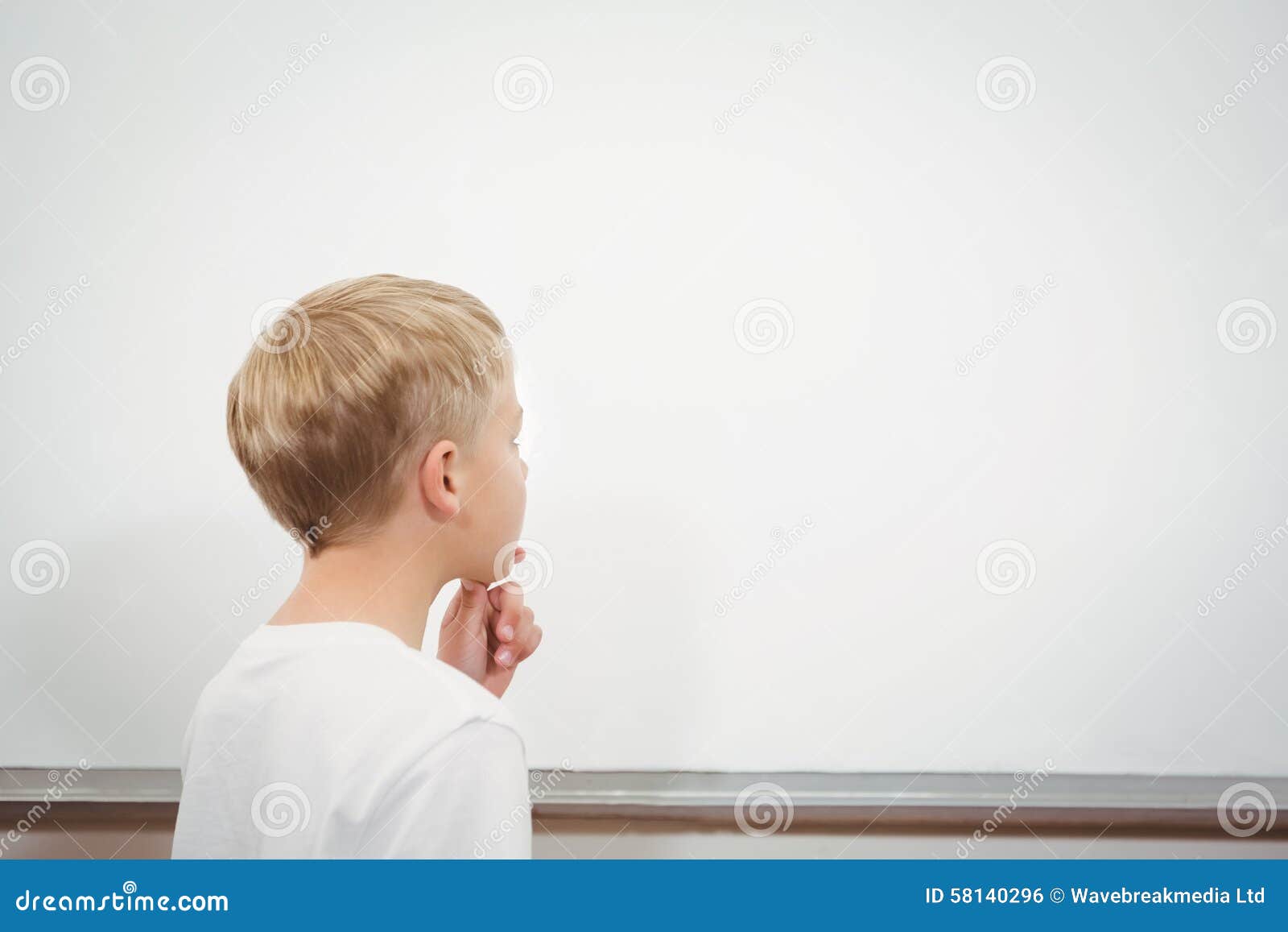 Puzzled Student Looking at Whiteboard Stock Photo - Image of back, male ...
