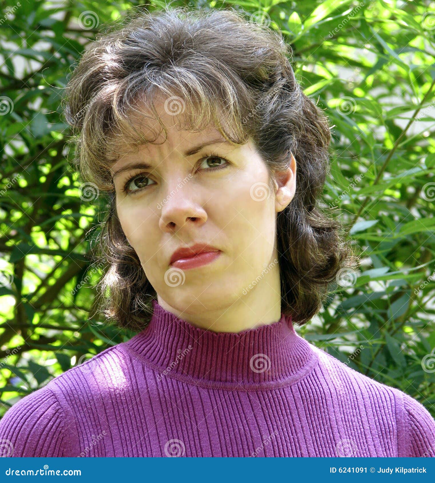 Puzzled Young Woman Looking Up Stock Image - Image of summer, leaves ...