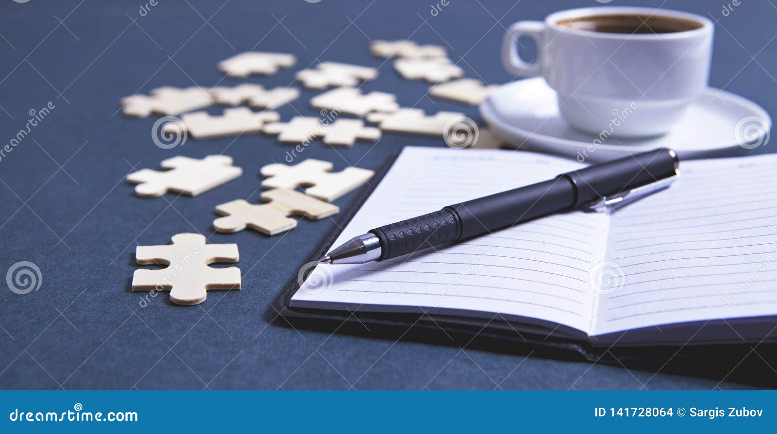 Puzzles notebook coffee stock photo. Image of coincide - 141728064