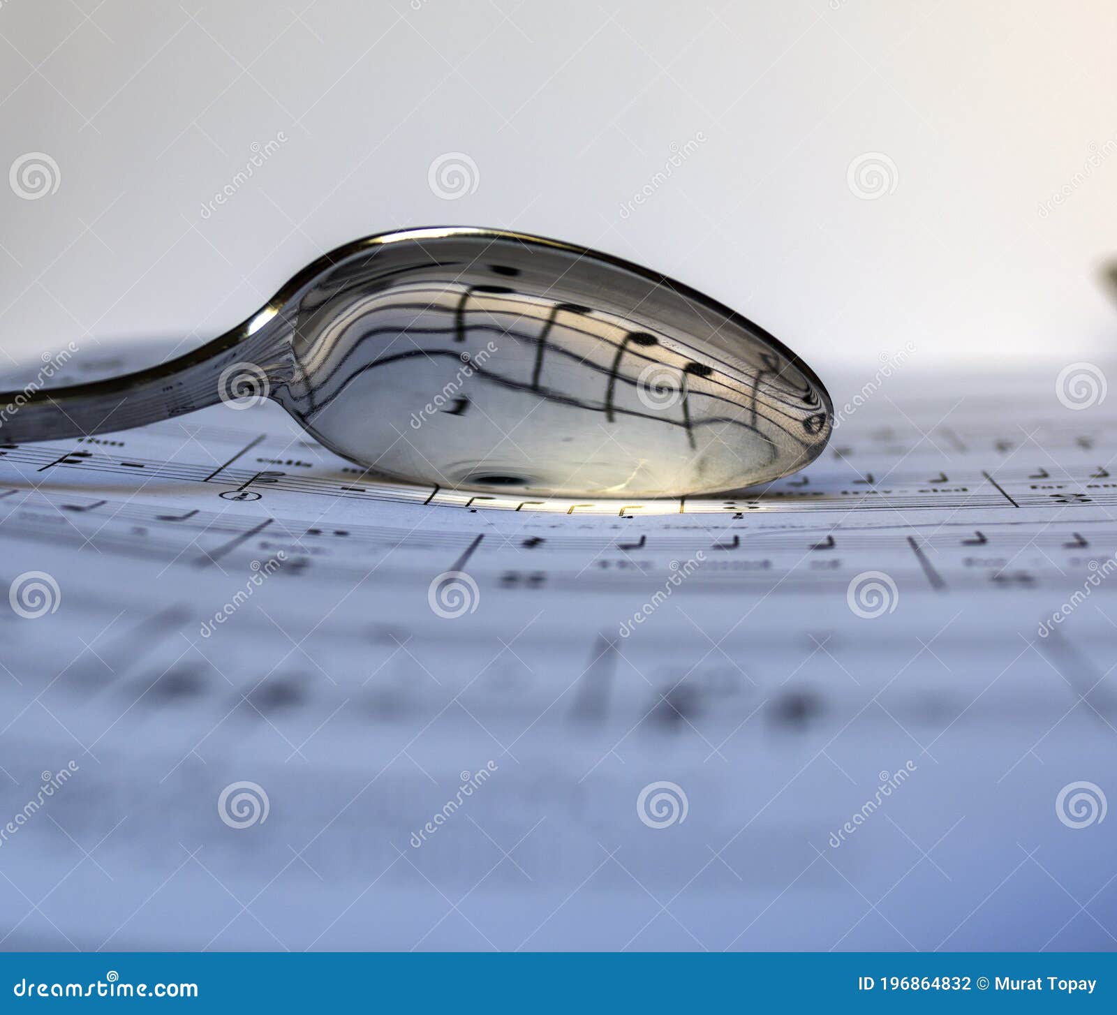 Musical Notes Reflect Off the Spoon Stock Photo - Image of reflection ...