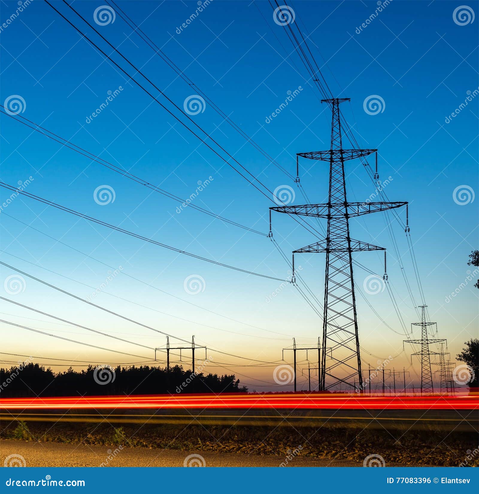 Pylons and Electricity Power Lines at Night with Traffic Lights. Stock ...