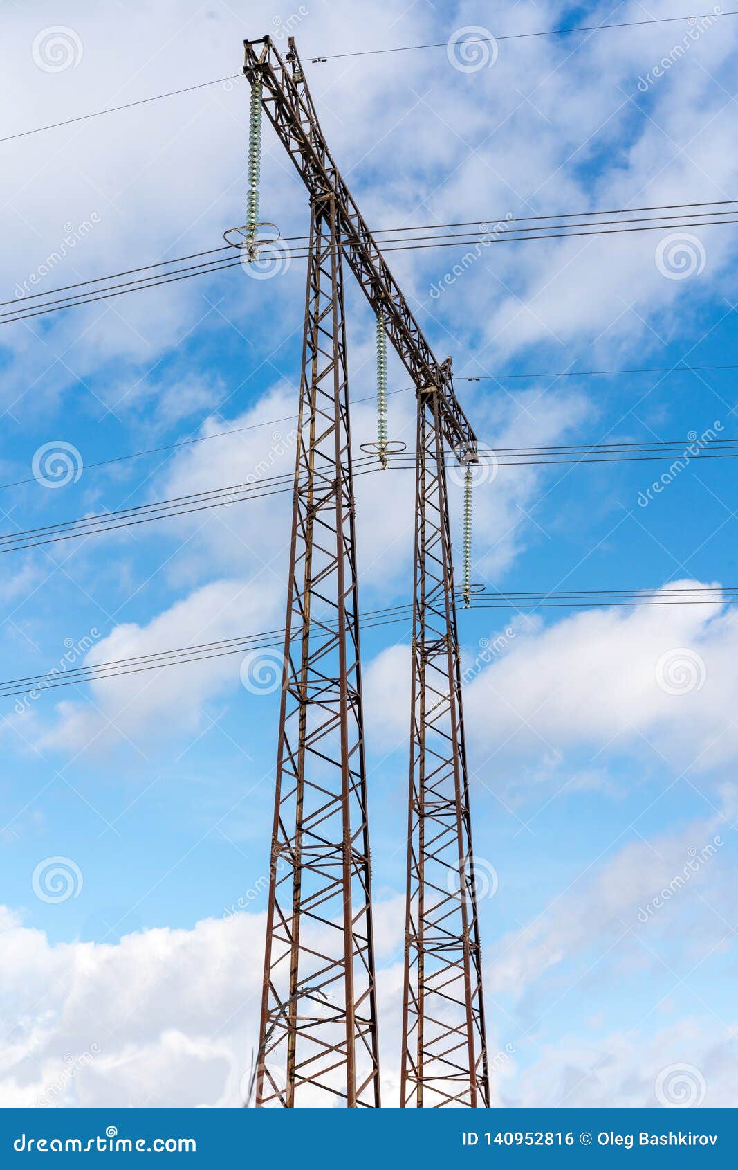 Pylons Of High-voltage Power Lines And A Blue Sky With Clouds Stock ...