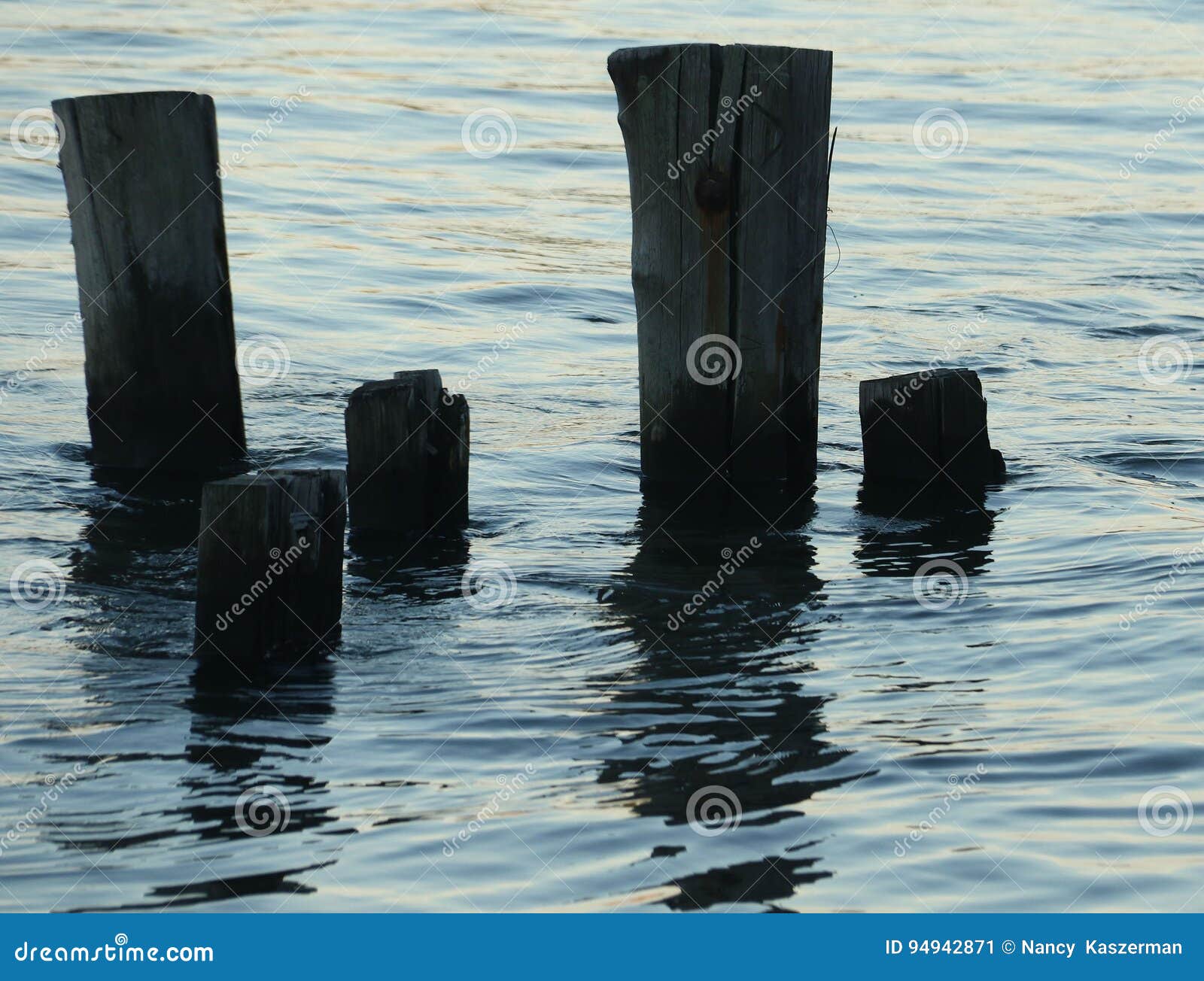 Pylons in Water at Sunset stock image. Image of nightfall - 94942871