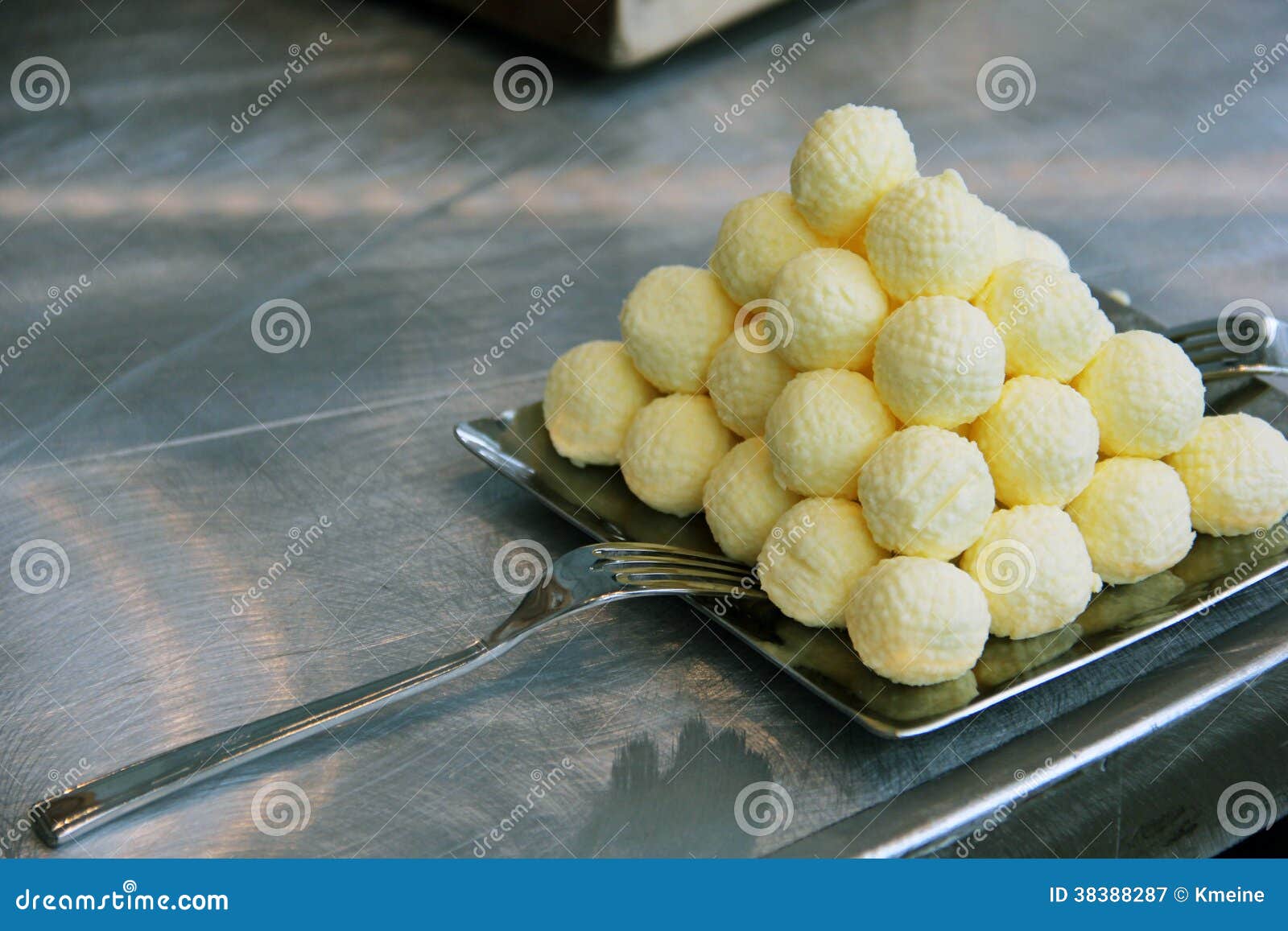 Pyramid of Butter Balls on Stainless Steel Plate Stock Image - Image of ...