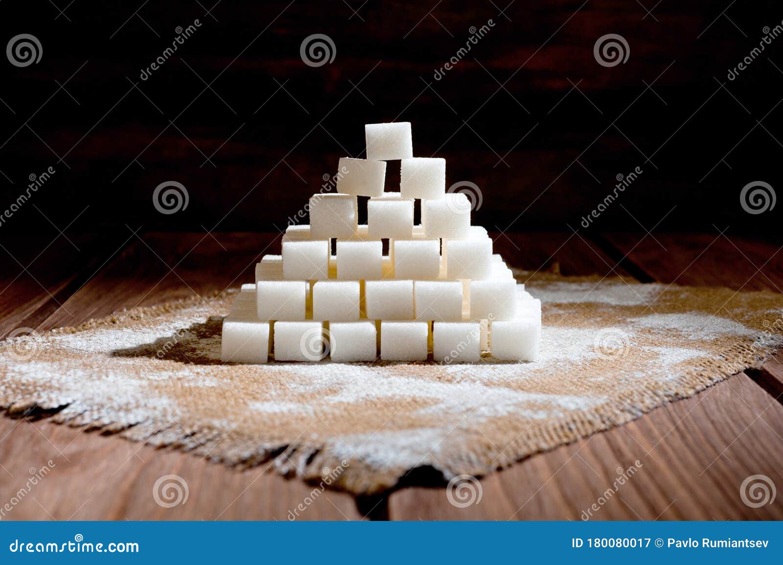A Pyramid Made of Refined Sugar Cubes, Standing on a Dark Wooden ...