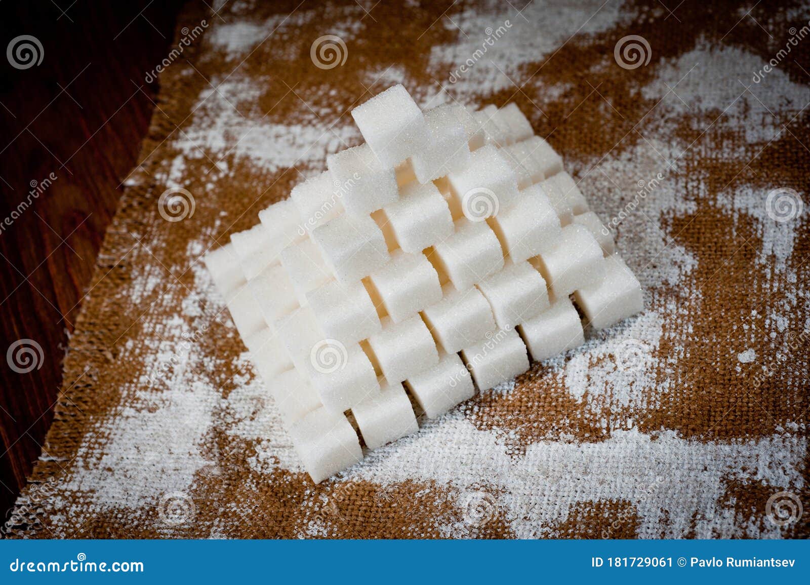 A Pyramid Made of Refined Sugar Cubes, Standing on a Dark Wooden ...