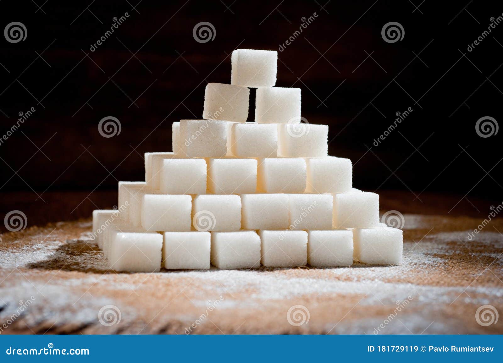 A Pyramid Made of Refined Sugar Cubes, Standing on a Dark Wooden ...