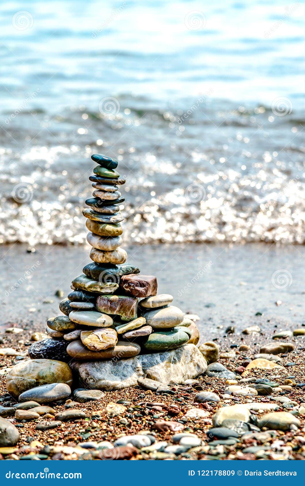 Pyramid of Pebbles on the Beach.Pyramid of Flat Colored Pebbles on the ...
