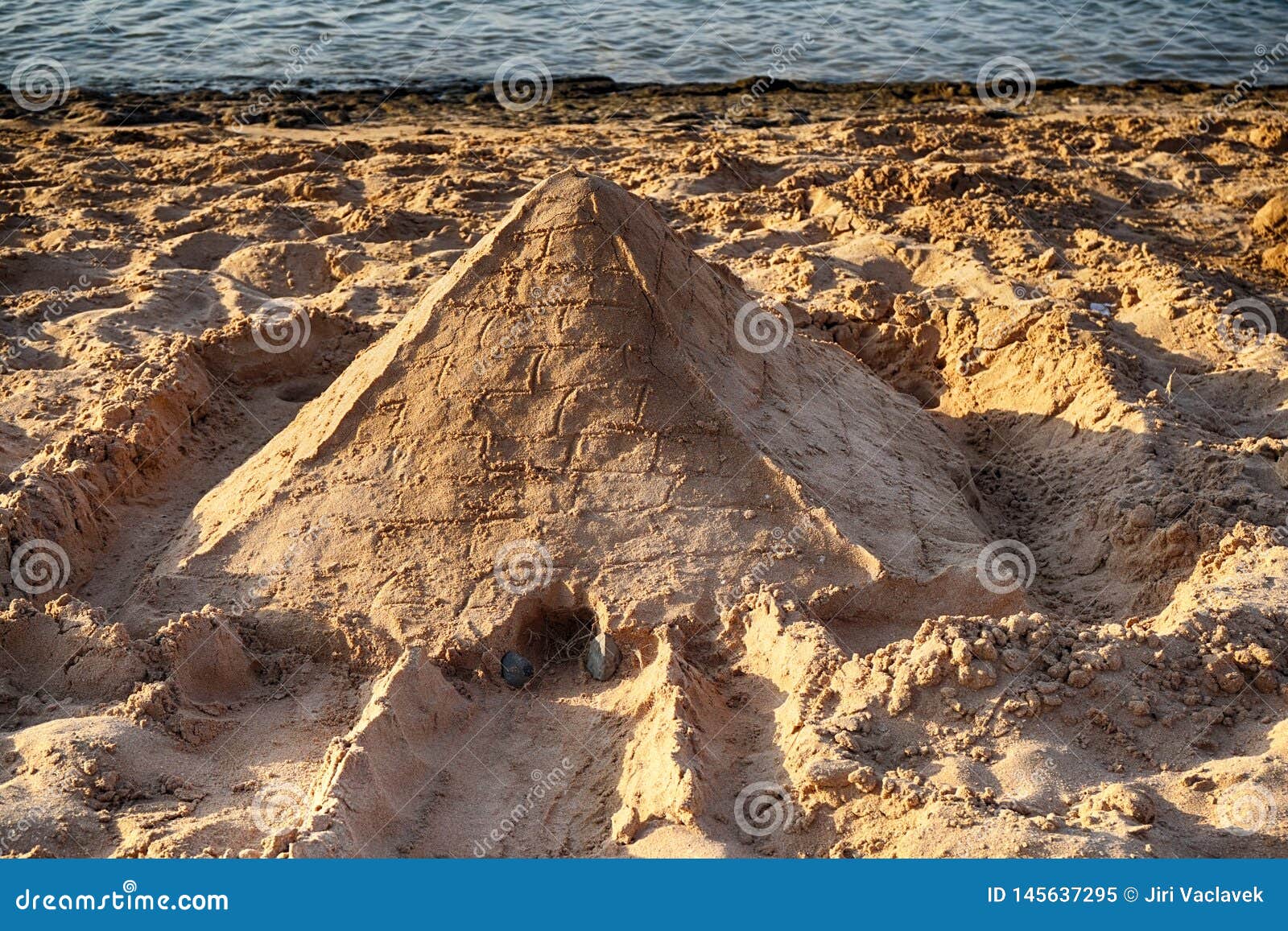 Pyramid from the sand stock image. Image of pyramid - 145637295
