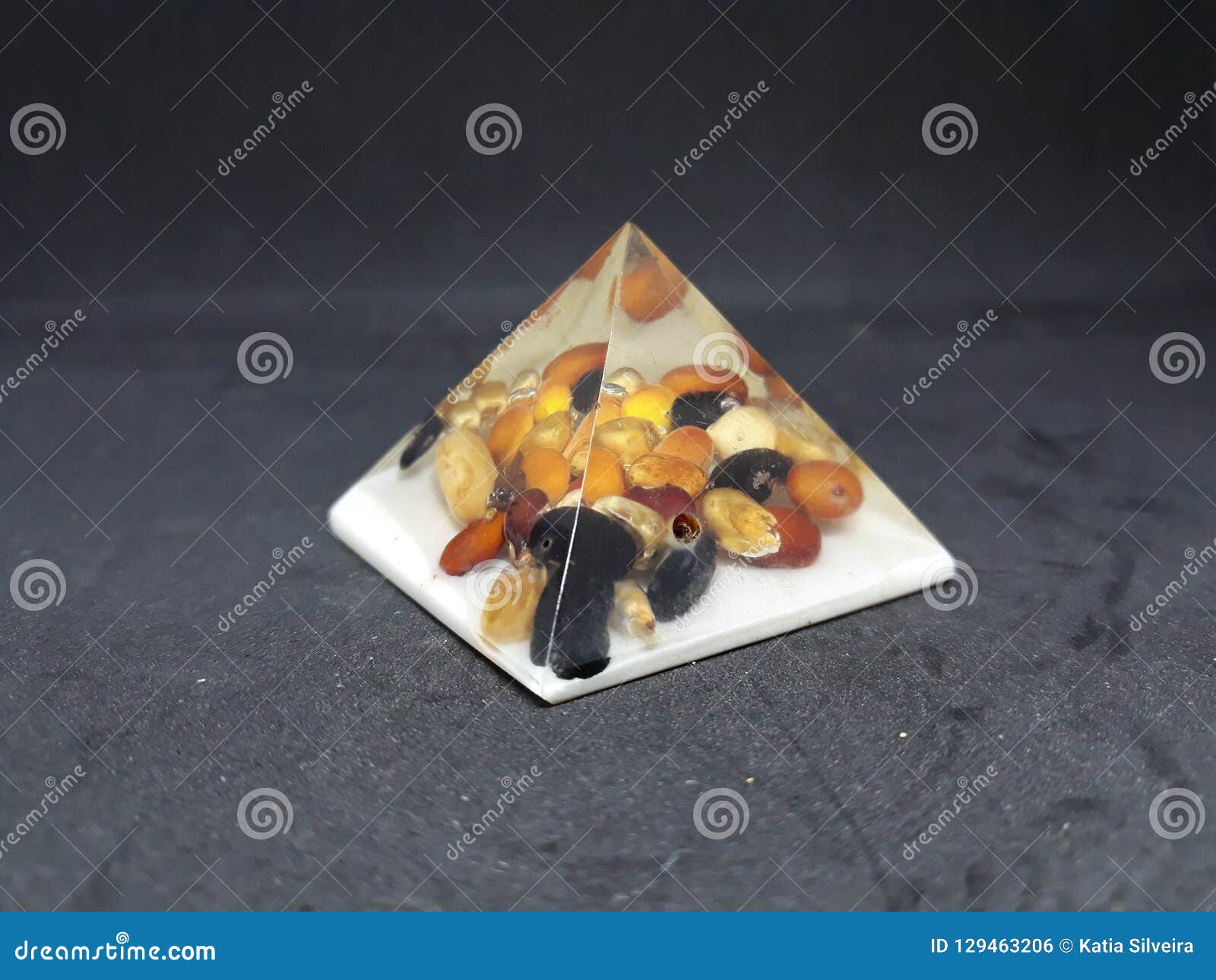 Pyramid with seeds inside stock photo. Image of crystal - 129463206