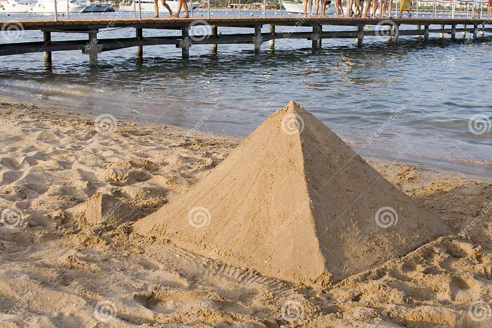 Pyramid Shaped Sand Castle stock photo. Image of sand - 3415540