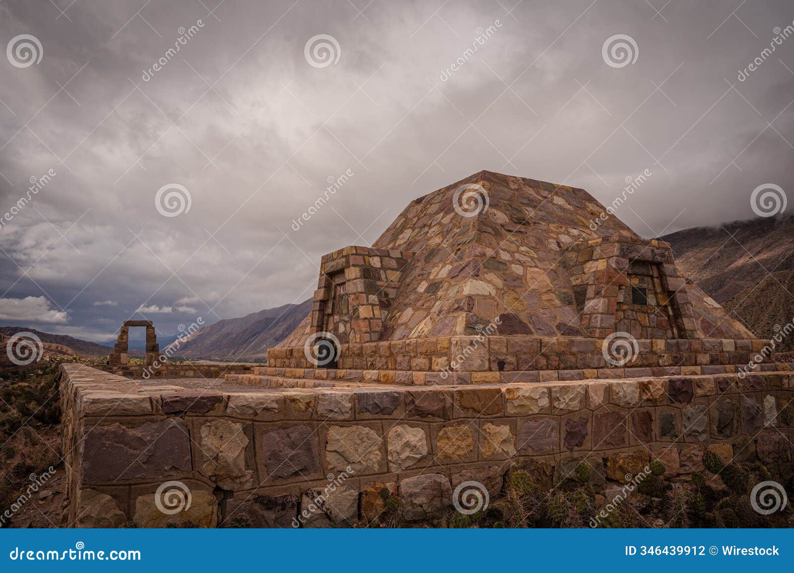 Pyramid-shaped Structure Stands Tall Against a Dramatic Backdrop of ...