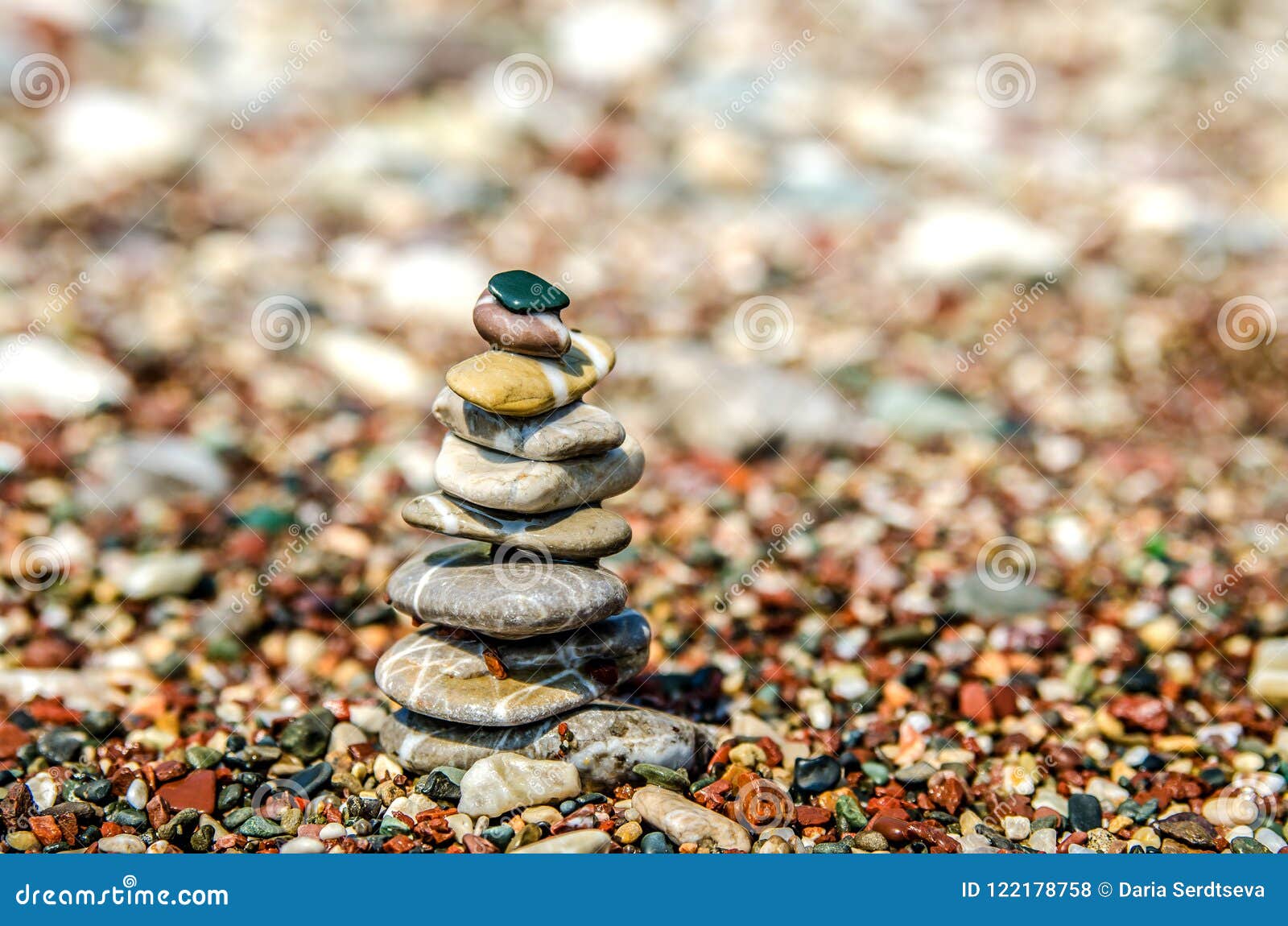 Pyramid of Small Stones Built on a Pebble Beach. Stock Photo - Image of ...