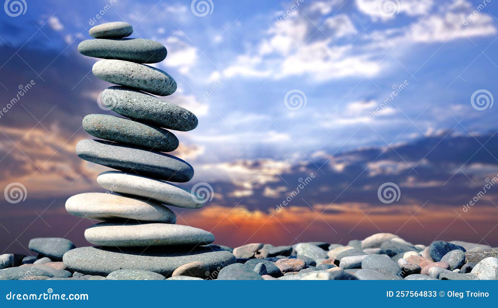 Pyramid of Smooth Stones Against the Backdrop of a Sunset. Natural ...