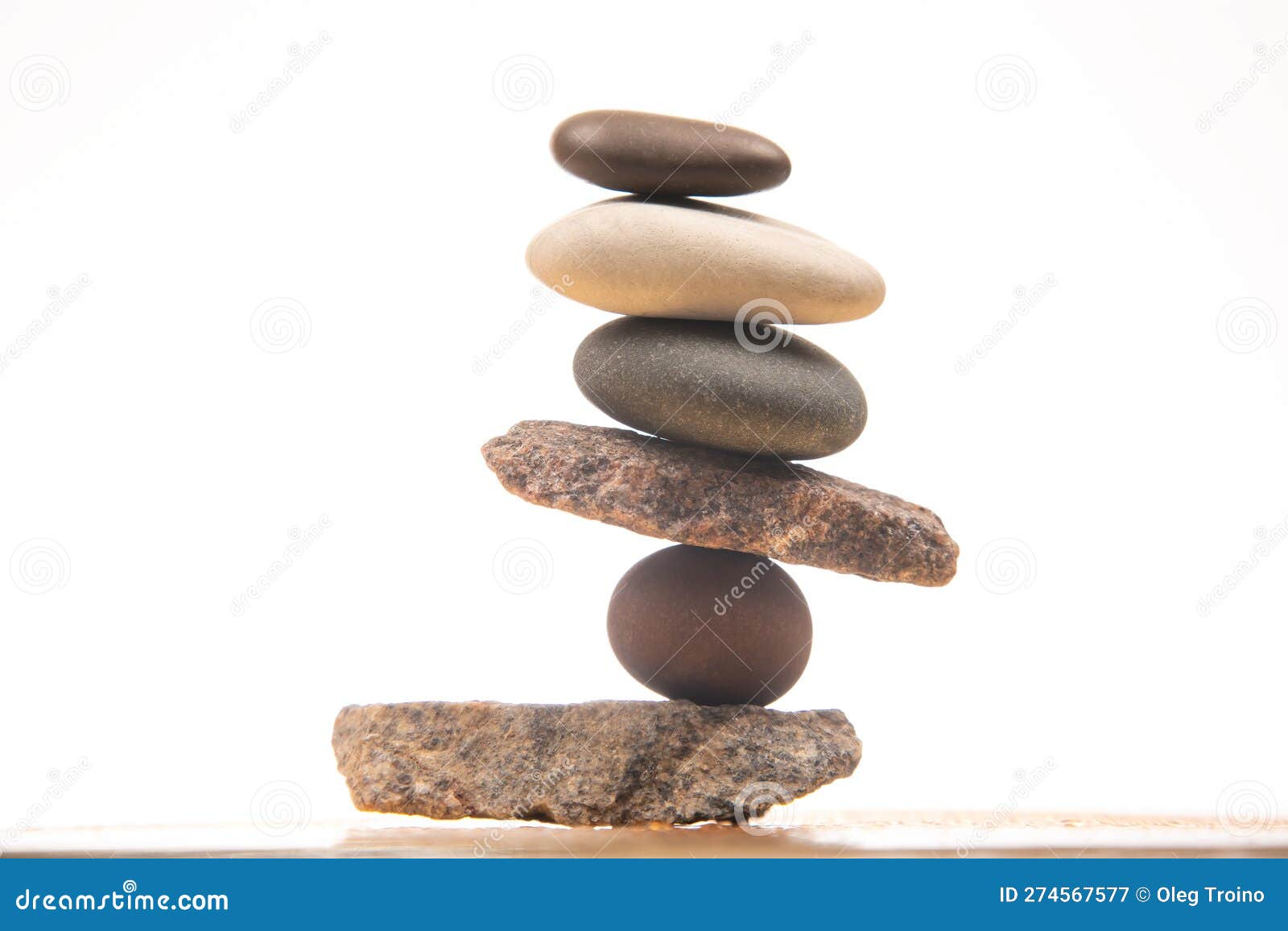 Pyramid of Stacked Stones on a White Background. Stabilization and ...