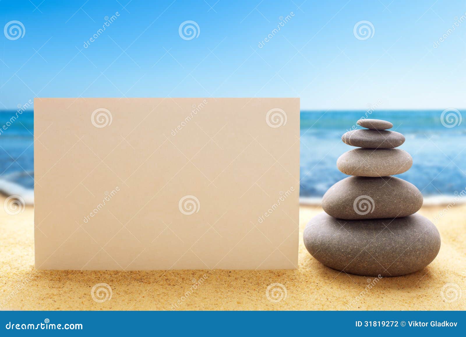 Pyramid of the Stones with Blank Paper on the Sandy Beach Stock Photo ...