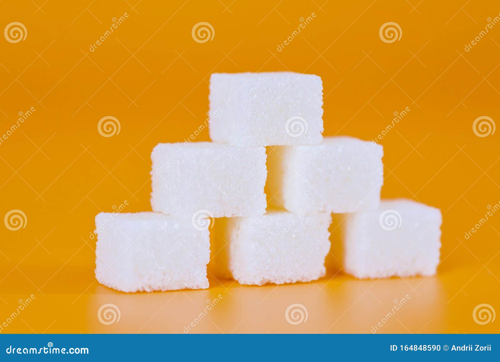 Pyramid from Sugar Cubes on a Orange Background. the Pyramid is Made Up ...