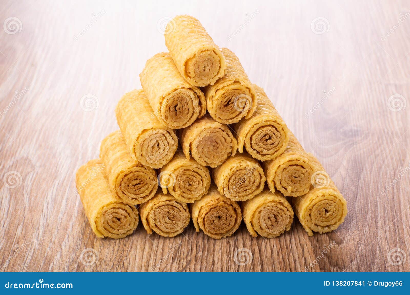 Pyramid from Wafer Rolls on Wooden Table Stock Image - Image of pyramid ...