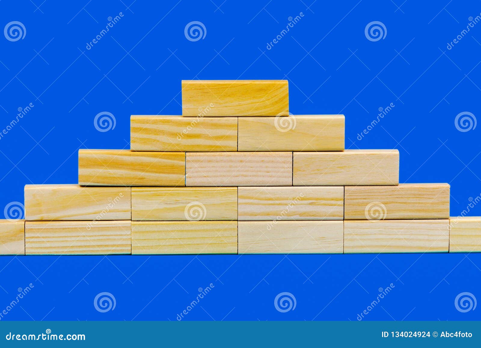 Pyramid of wooden blocks stock photo. Image of balance - 134024924