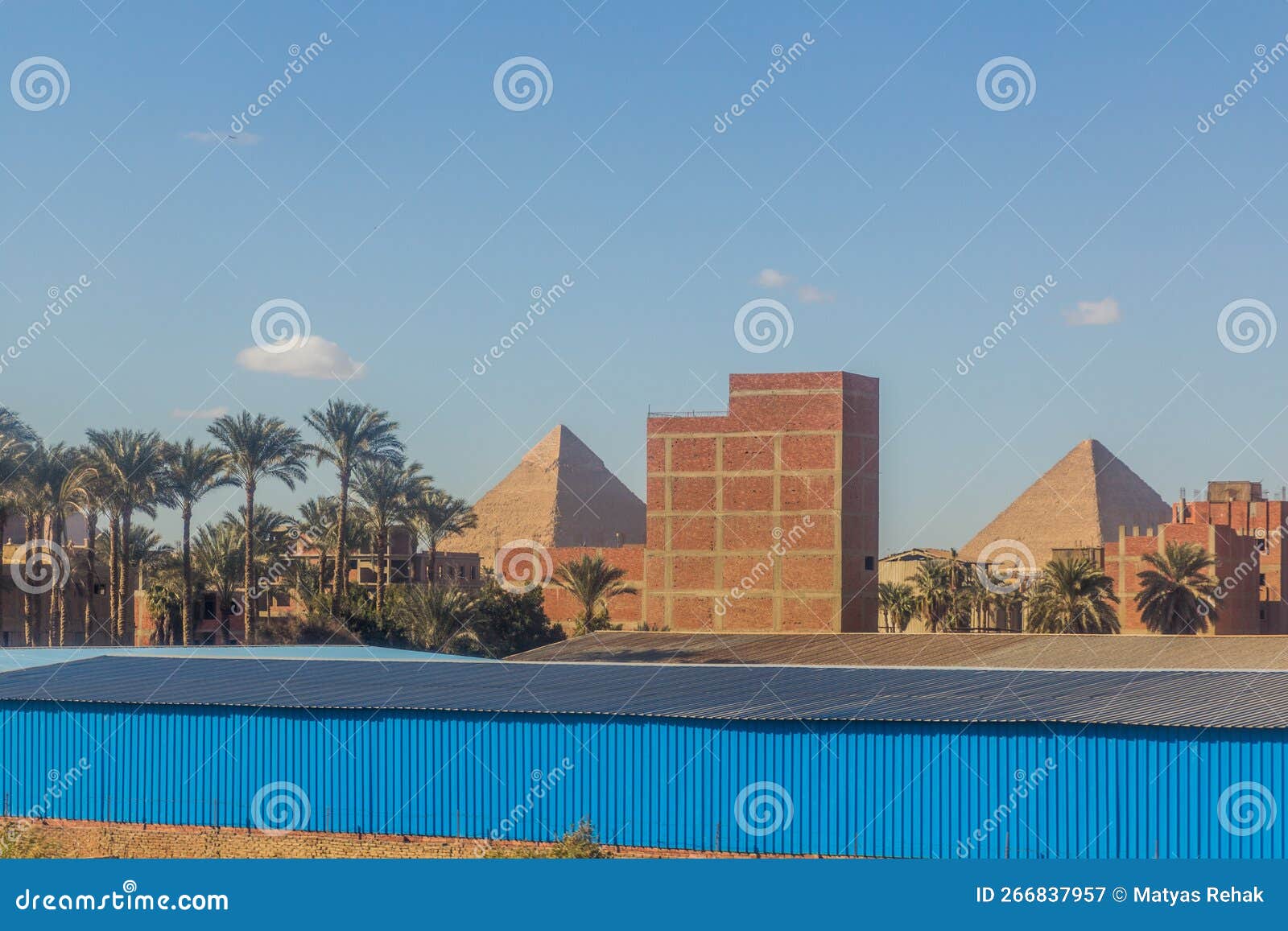 Pyramids Behind Buildings of Giza, Egy Stock Image - Image of unesco ...