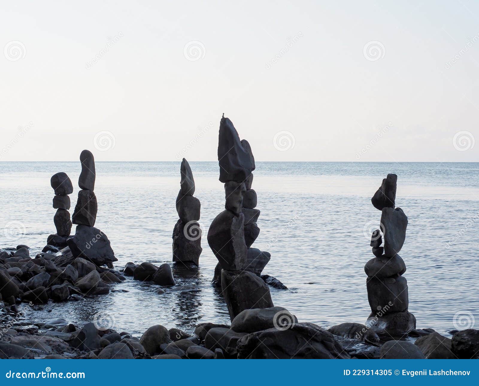 Pyramids Built of Large Stones Stand Against the Backdrop of a Calm Sea ...