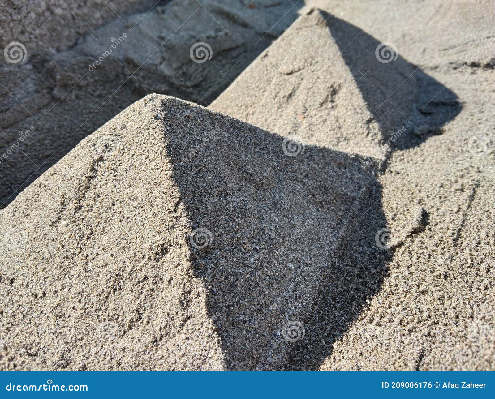 Pyramids of Egypt by Sand Artist. Stock Photo - Image of news, books ...