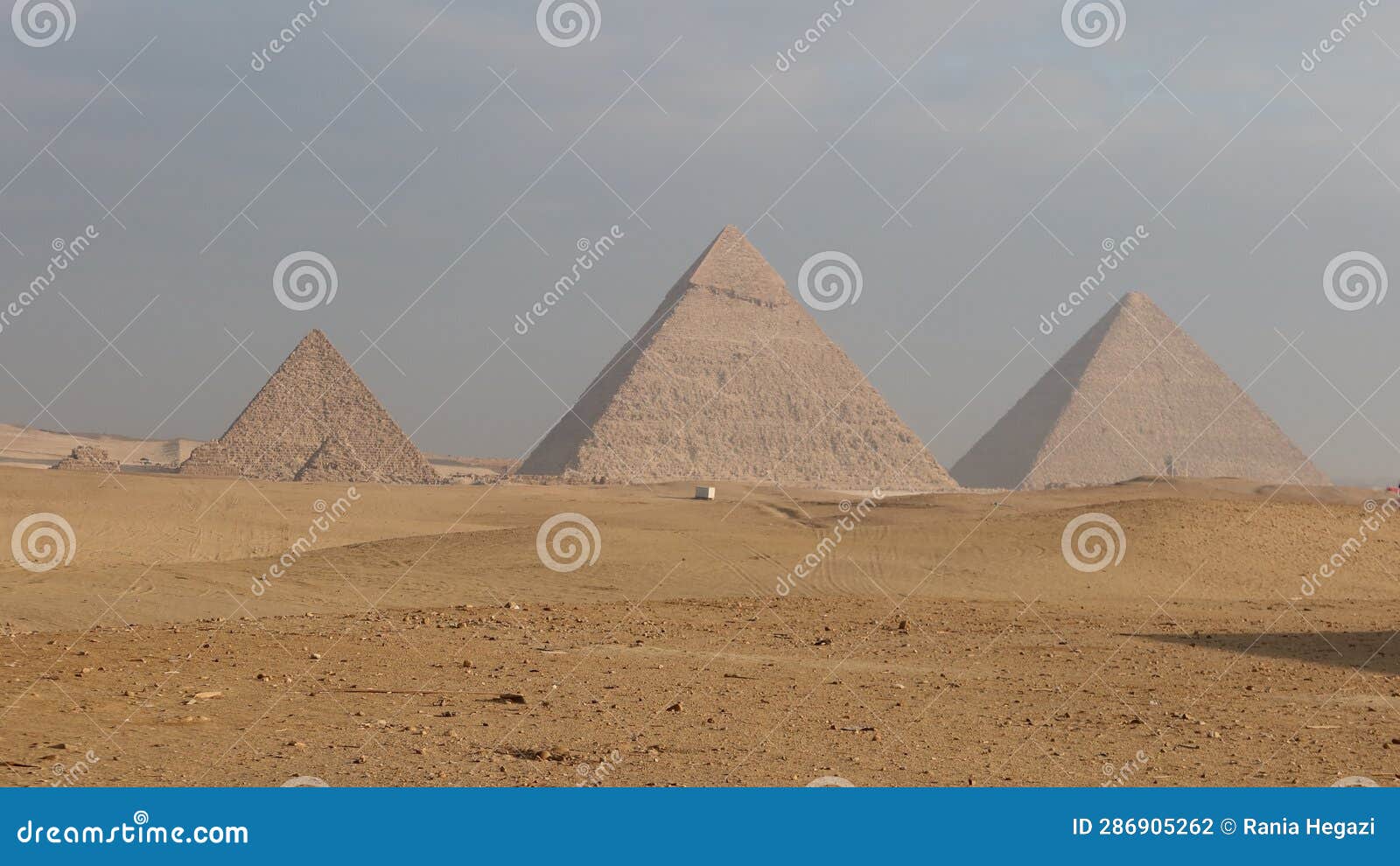 The Pyramids of Egypt Side by Side in the Middle of Desert Sand with ...
