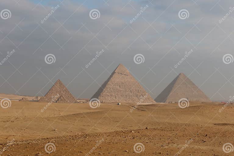 The Pyramids of Egypt Side by Side in the Middle of Desert Sand with ...