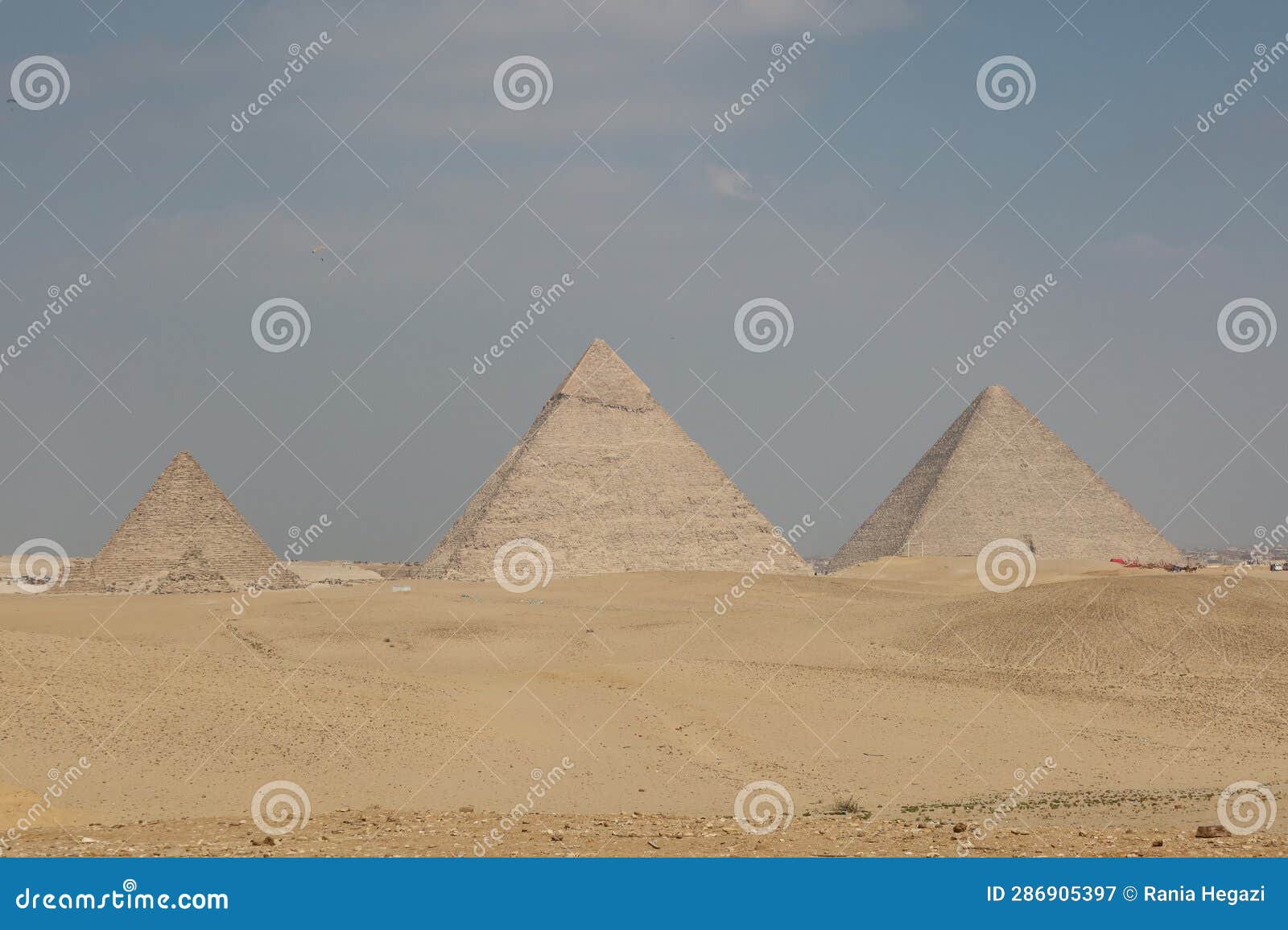 The Pyramids of Egypt Side by Side in the Middle of Desert Sand with ...