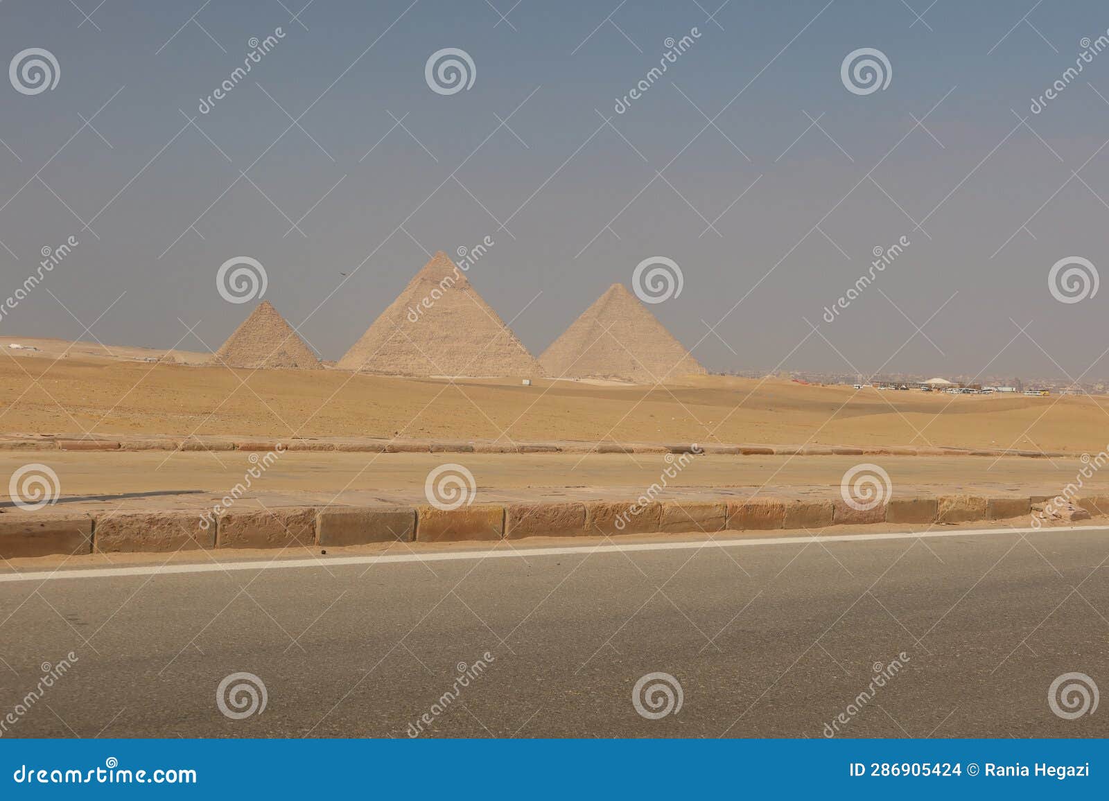 The Pyramids of Egypt Side by Side in the Middle of Desert Sand with ...