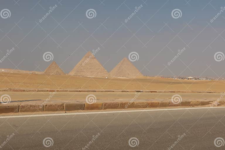 The Pyramids of Egypt Side by Side in the Middle of Desert Sand with ...
