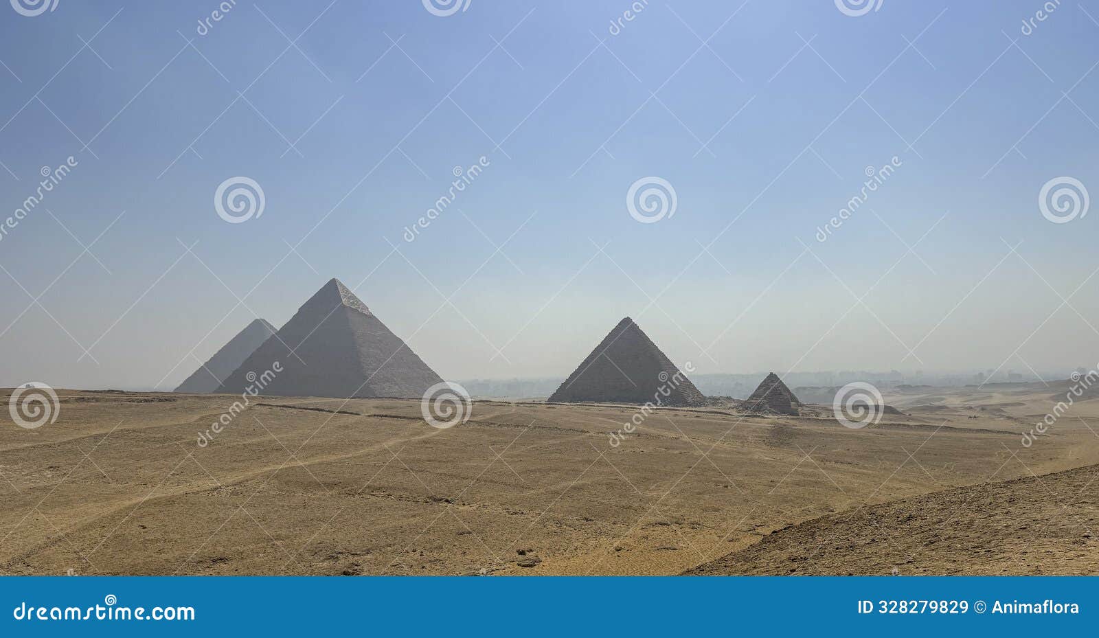 Pyramids of Giza with Blue Sky and Desert in the Foreground Stock Image ...