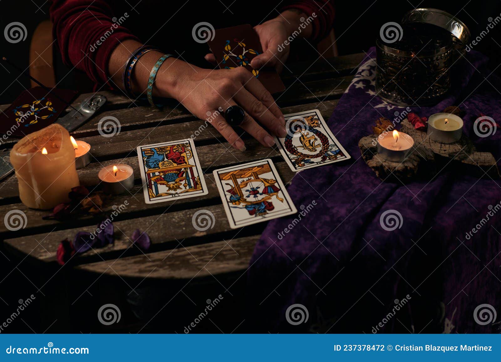 Pythoness Reads Tarot Cards on a Table with Candles Stock Photo - Image ...