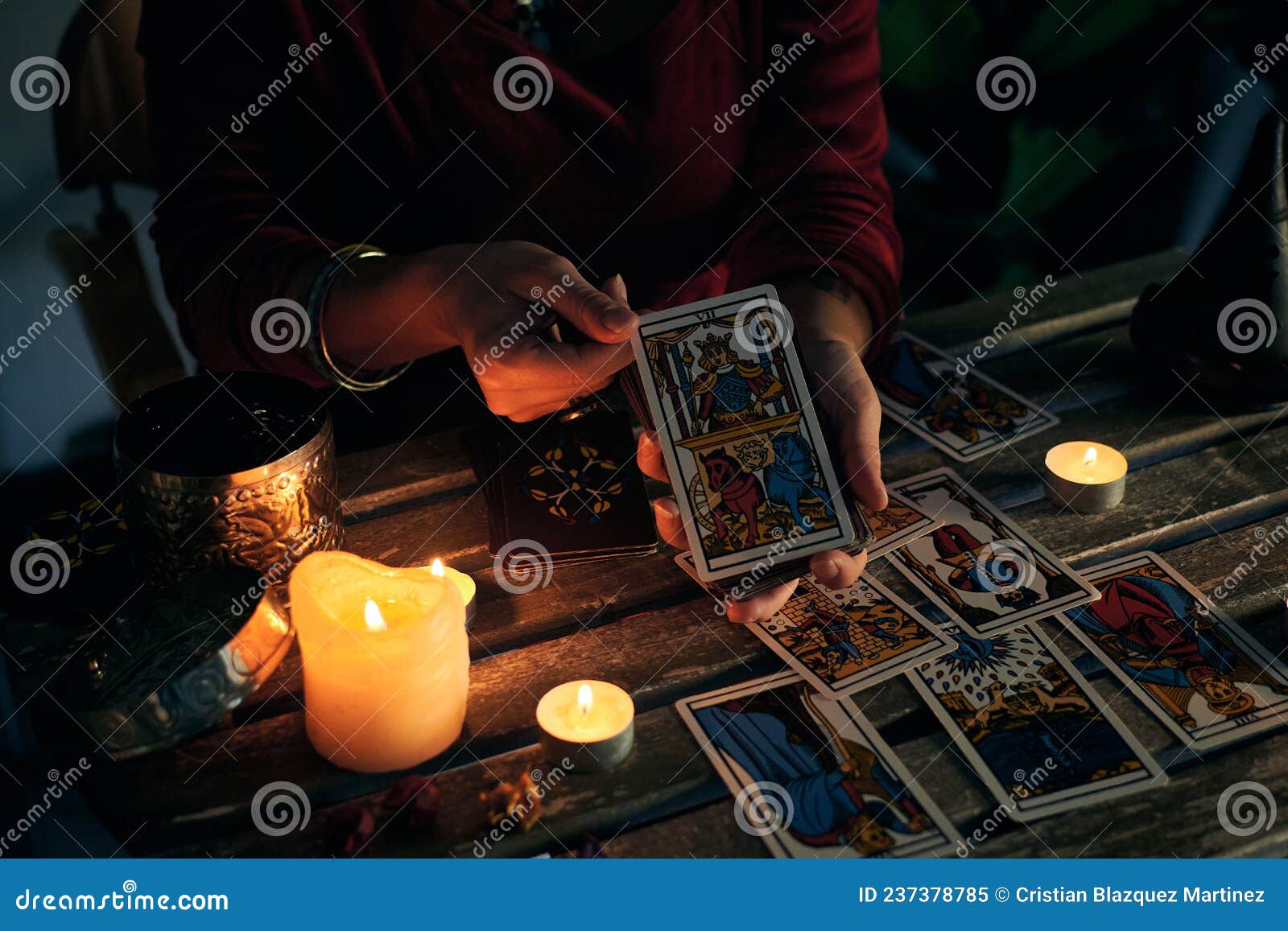A Pythoness Shows Tarot Cards on a Wooden Table Stock Image - Image of ...
