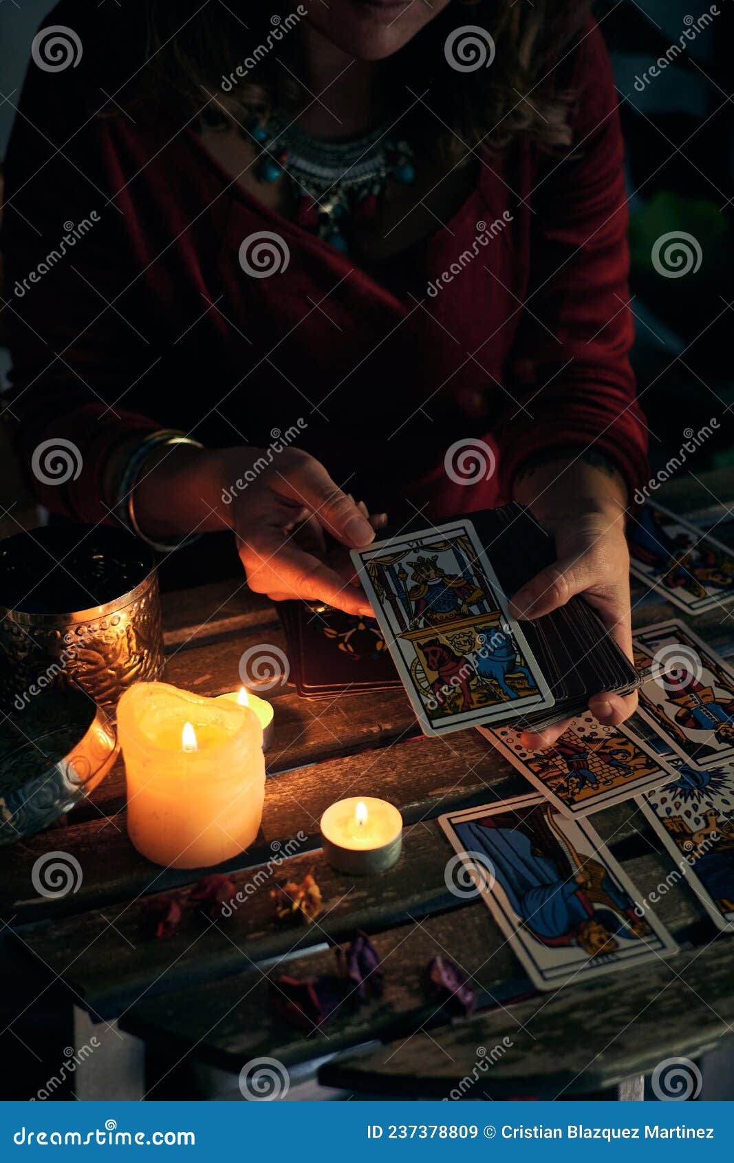 A Pythoness Shows Tarot Cards on a Wooden Table Stock Image - Image of ...
