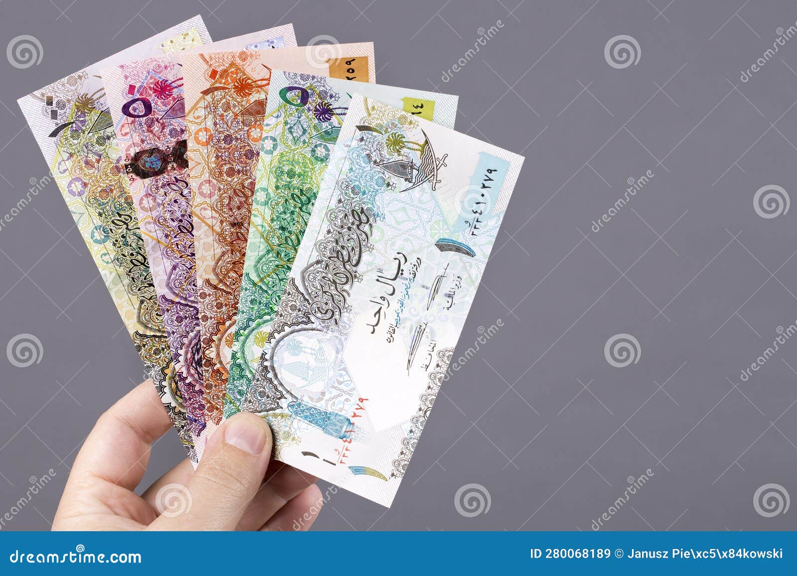 Qatari Money in the Hand on a Gray Background Stock Image - Image of ...