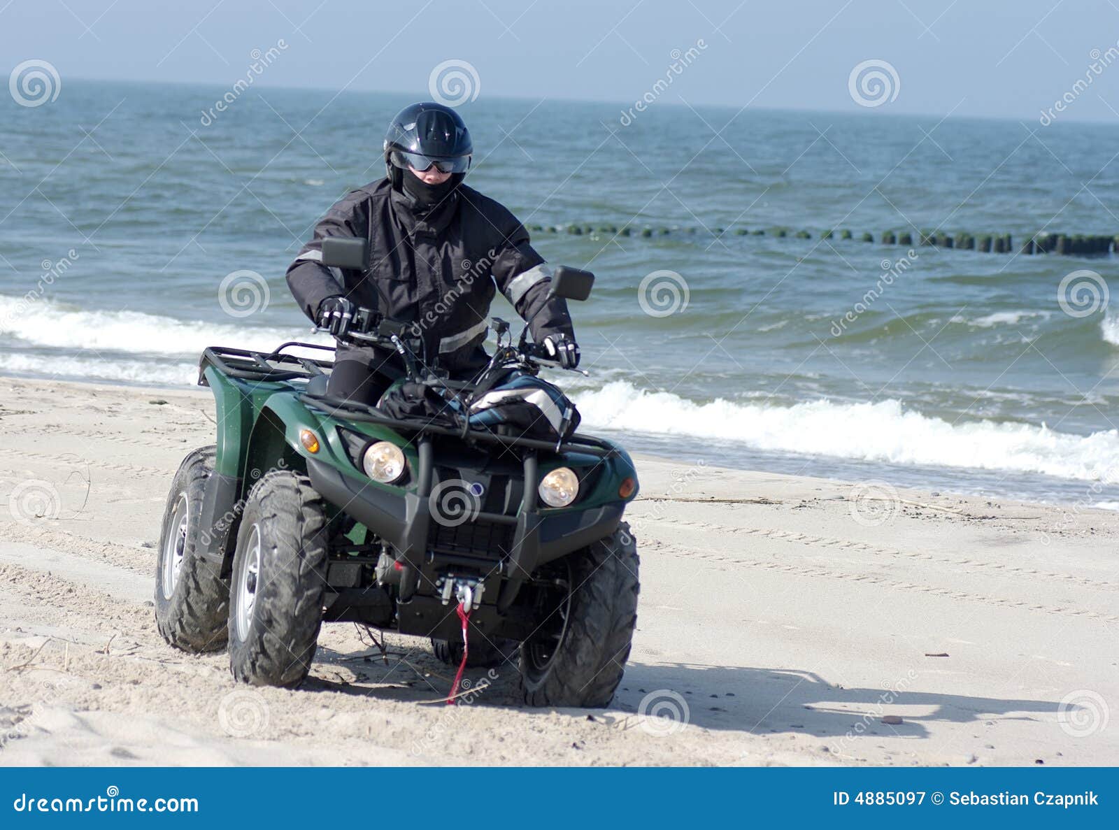 Quad on a beach (ATV) stock image. Image of rider, wave - 4885097