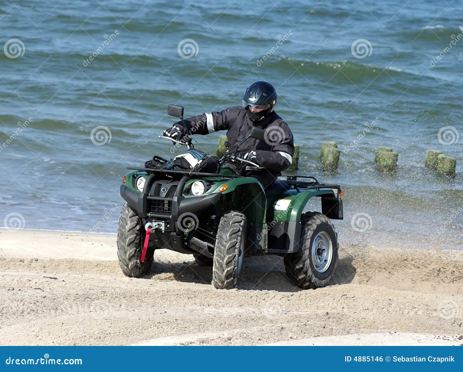 Quad on a beach (ATV) stock photo. Image of twists, swings - 4885146