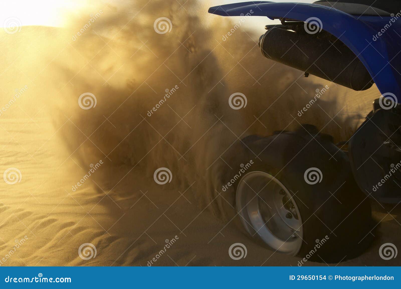 Quad Bike Spraying Up Sand stock photo. Image of immovable - 29650154